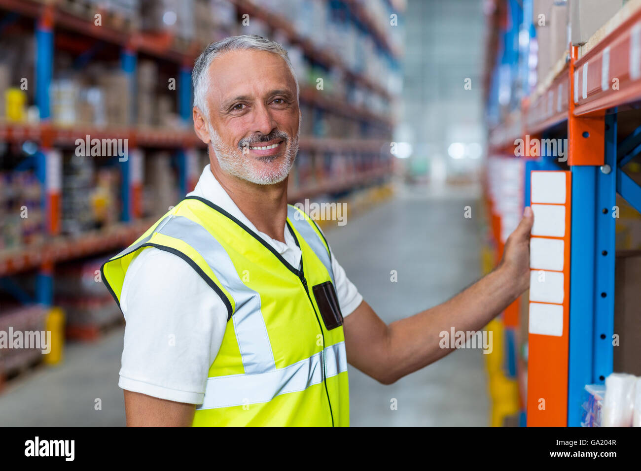 Portrait of happy worker is posing and looking the camera during work ...