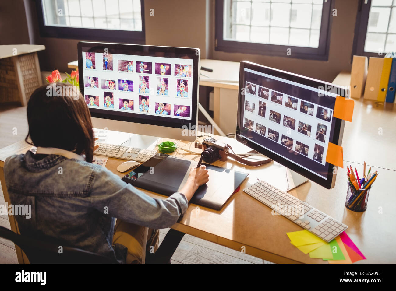 Graphic designer using graphics tablet Stock Photo - Alamy