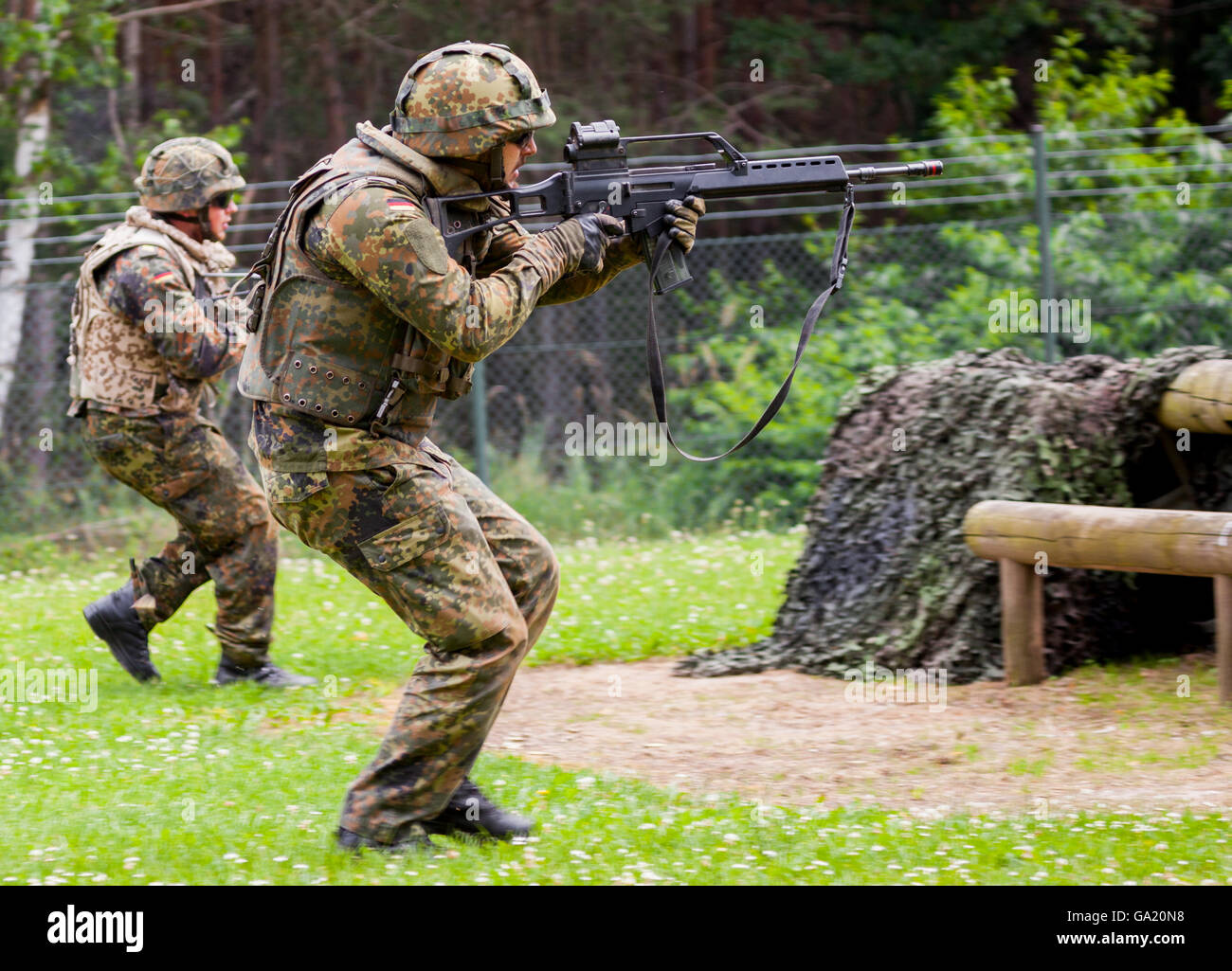 BURG / GERMANY - JUNE 25, 2016: german soldier fires with hk g 36 rifle ...