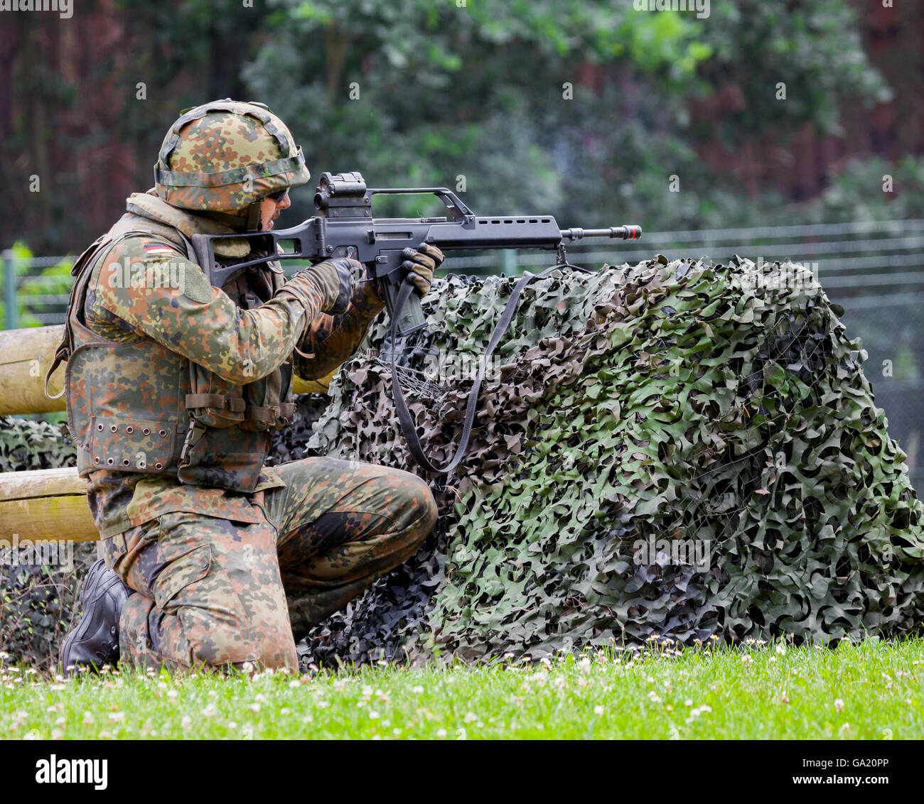 BURG / GERMANY - JUNE 25, 2016: german soldier fires with hk g 36 rifle ...