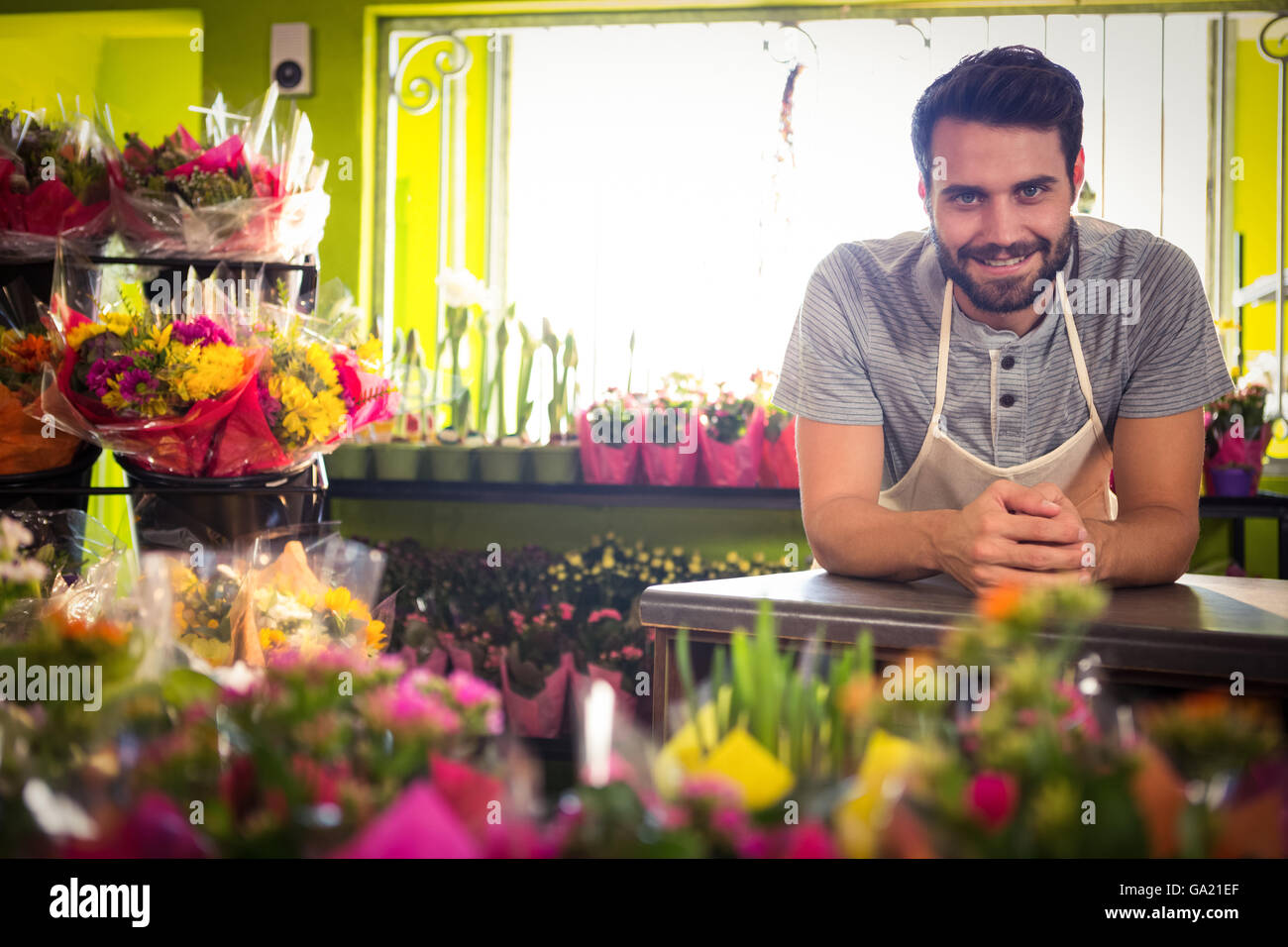 Male florist at his flower shop Stock Photo - Alamy