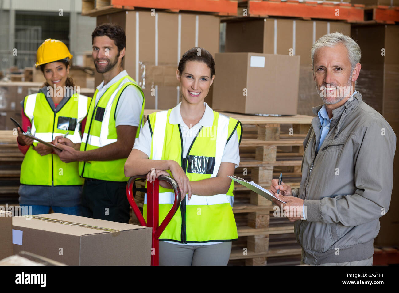Portrait of workers and manager are smiling and posing face to camera ...