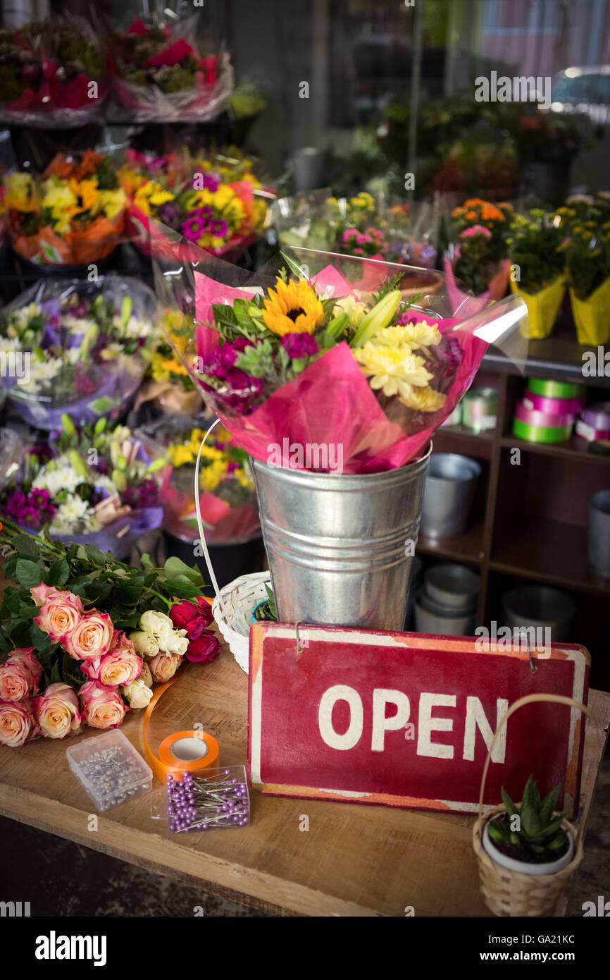 Open signboard on a wooden table Stock Photo - Alamy