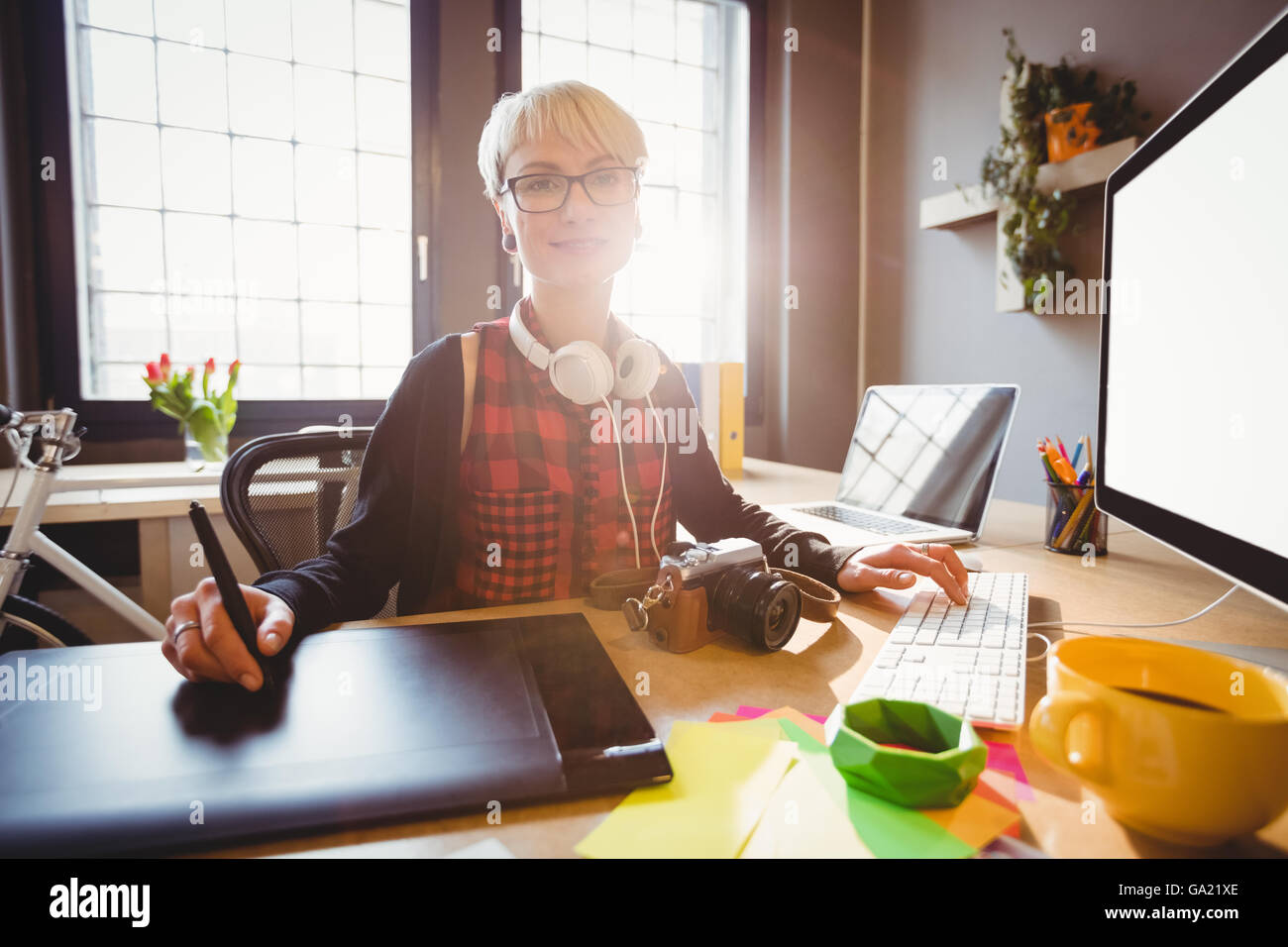Graphic designer using graphics tablet Stock Photo - Alamy