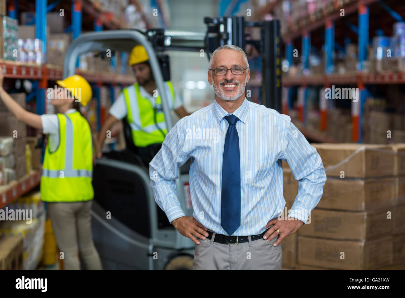 Portrait of manager is smiling and posing with hands on hips Stock ...
