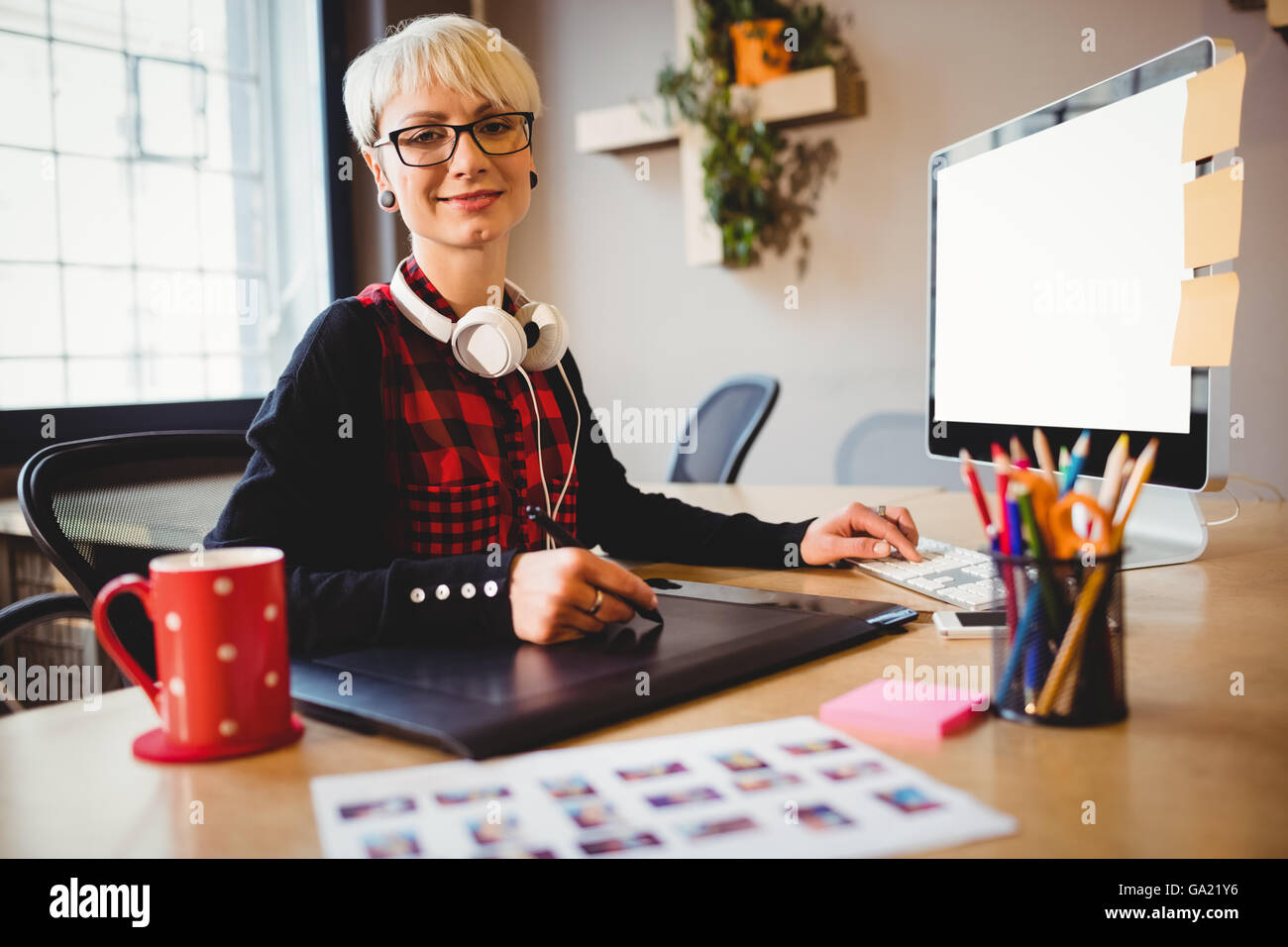 Graphic designer using graphics tablet Stock Photo - Alamy