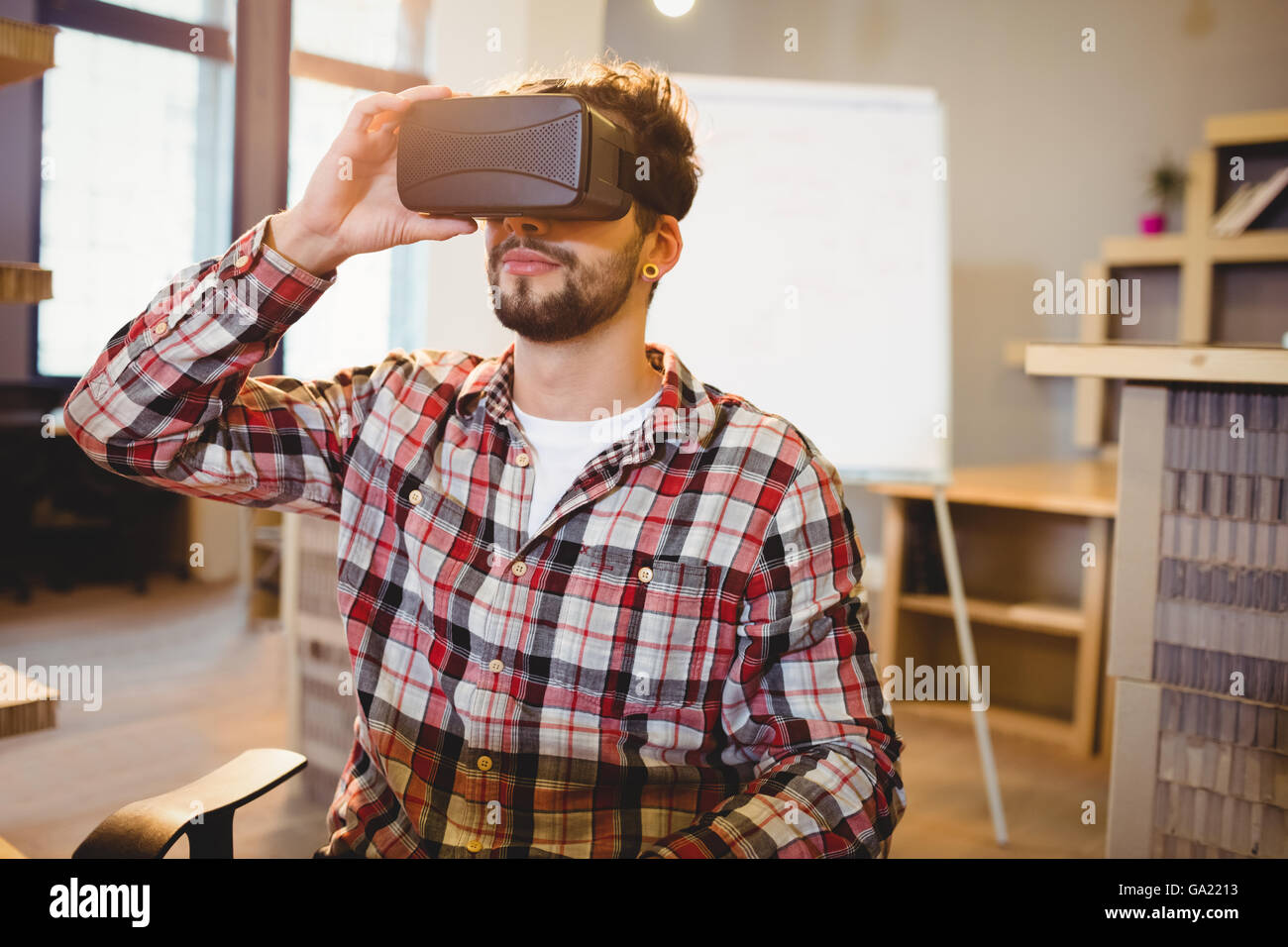 Man using virtual reality headset Stock Photo - Alamy
