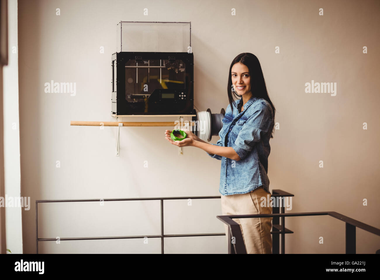 Female graphic designer holding model Stock Photo - Alamy