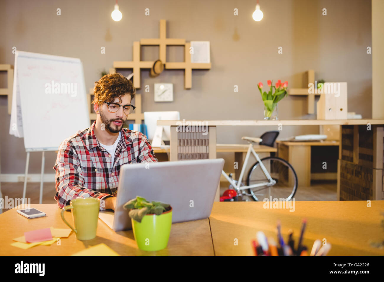 Graphic designer working on laptop Stock Photo - Alamy