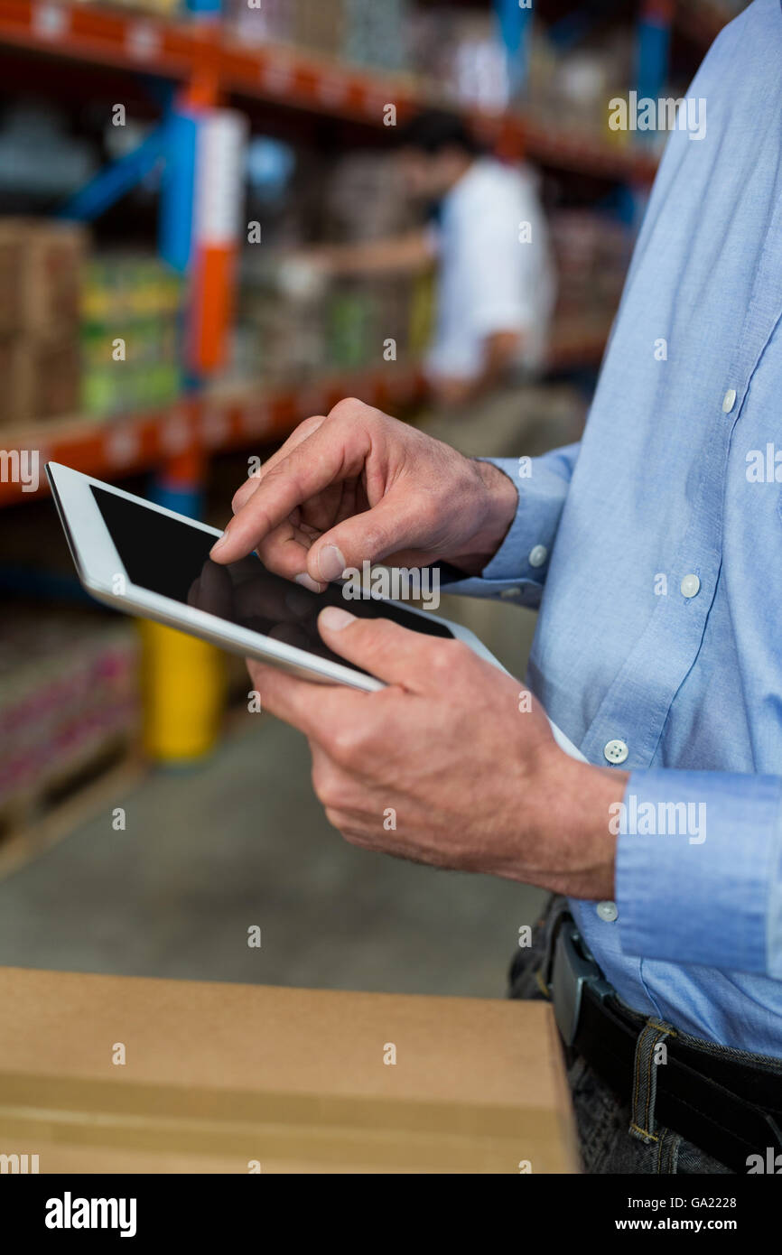 Close up of manager hands using a tablet Stock Photo - Alamy