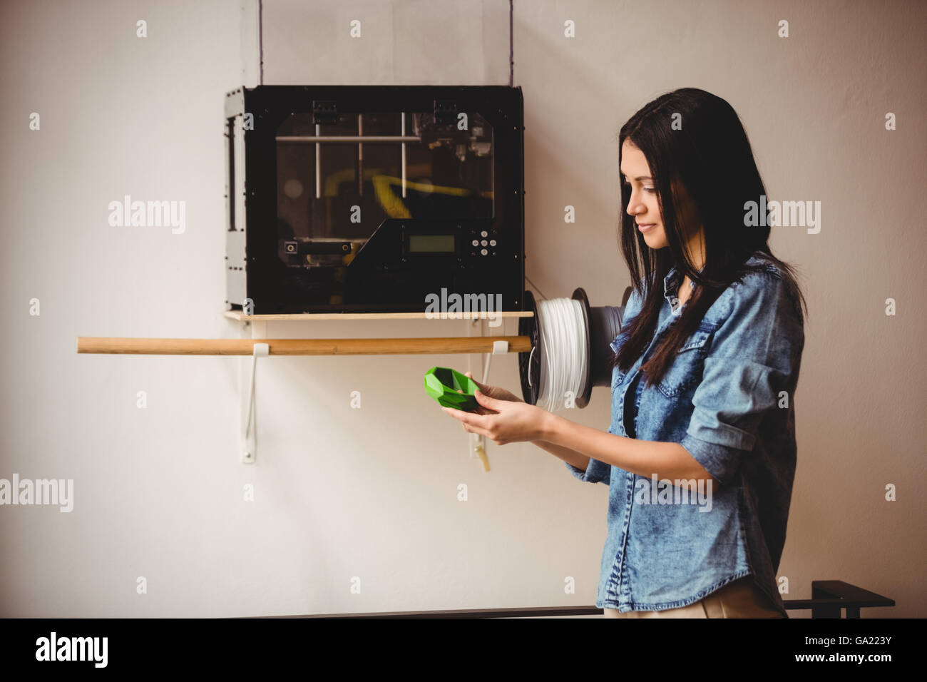 Female graphic designer holding model Stock Photo - Alamy