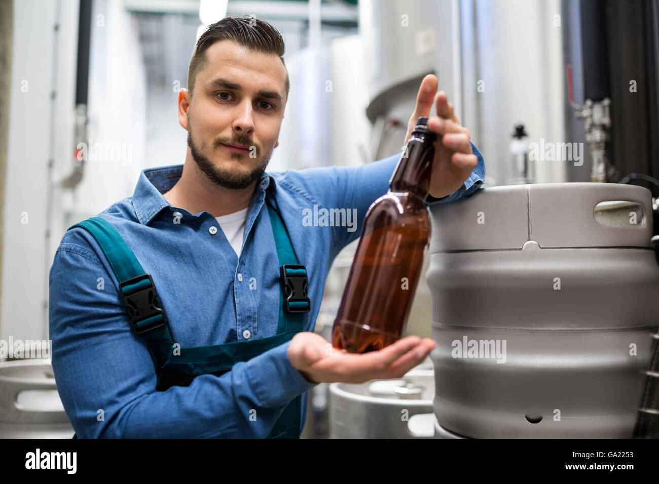 Brewery testing beer bottle Stock Photo - Alamy