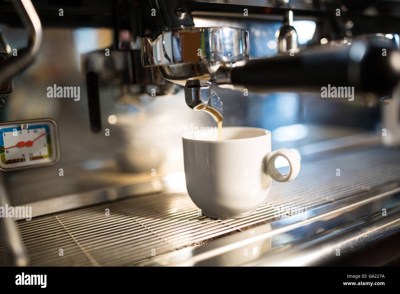 Coffee machine making a cup of coffee Stock Photo - Alamy