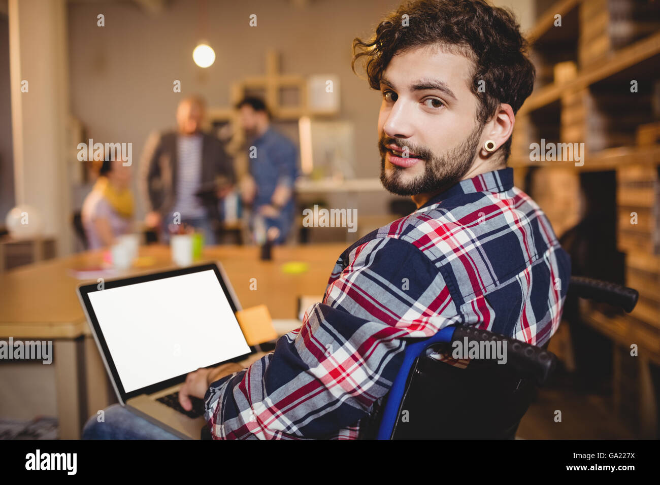 Graphic designer using laptop Stock Photo - Alamy