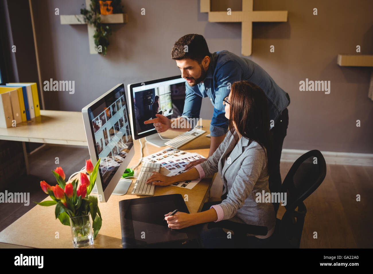 Pointing at monitor hi-res stock photography and images - Alamy