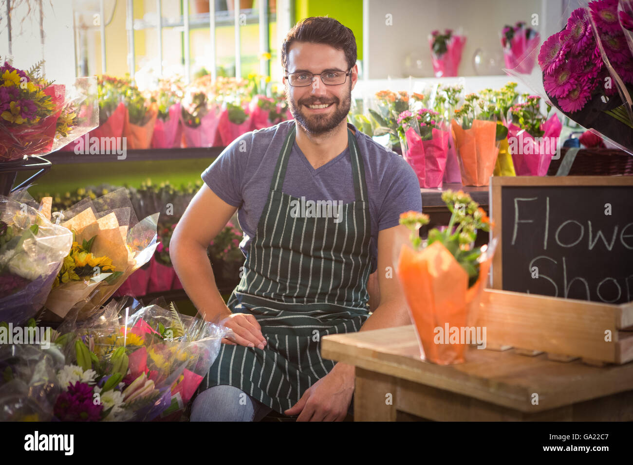 Male florist at his flower shop Stock Photo - Alamy