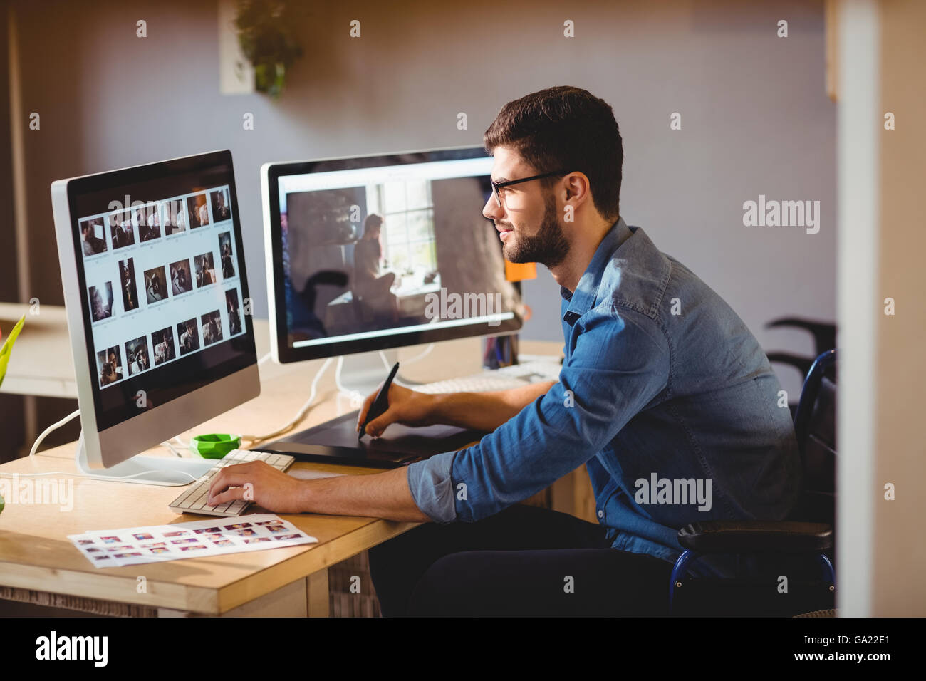 Graphic designer using a graphics tablet Stock Photo - Alamy