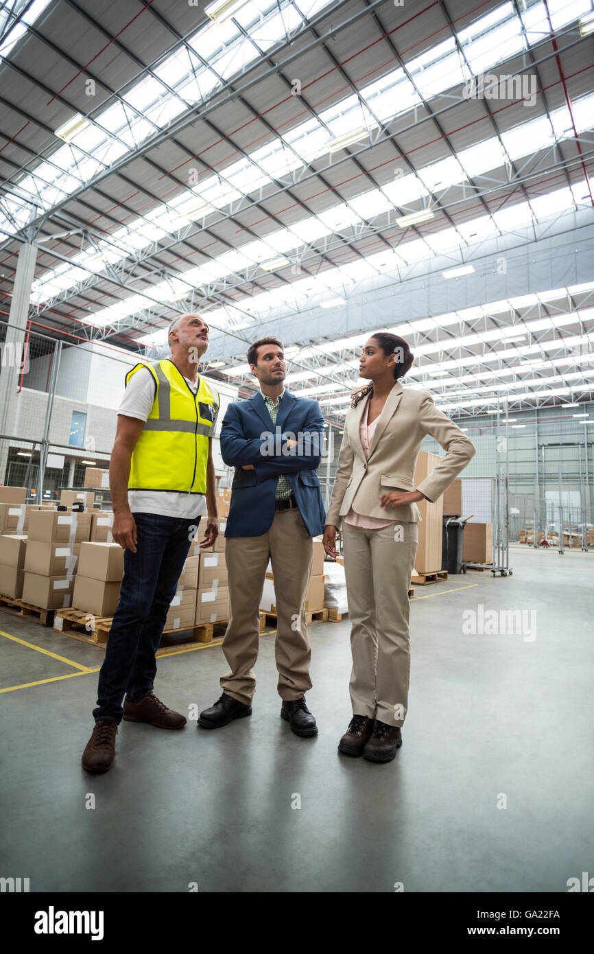 Low angle view of worker team is talking Stock Photo - Alamy