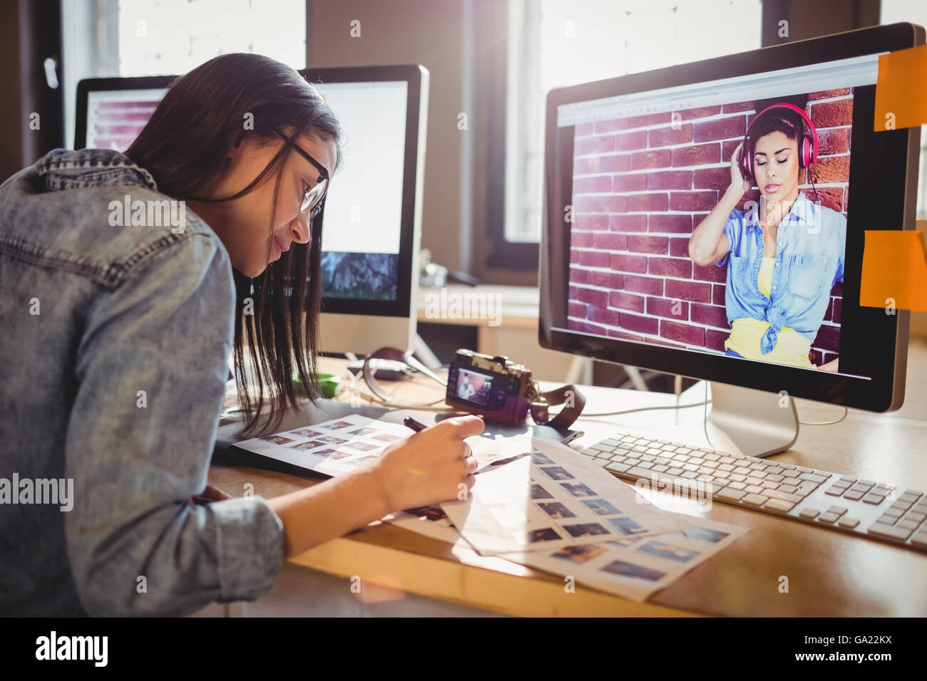 Graphic designer working at office Stock Photo - Alamy