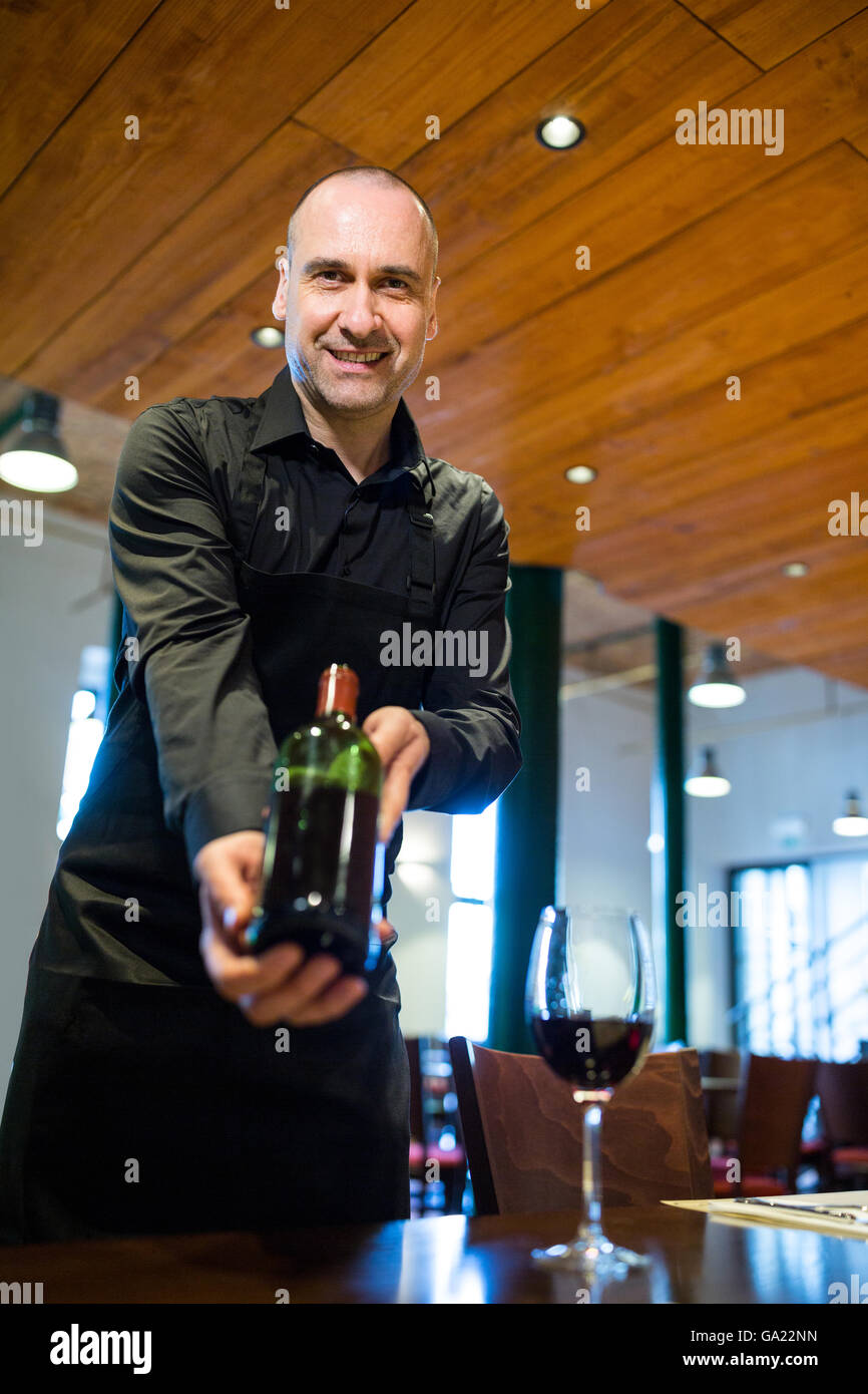 Waiter presenting wine bottle hi-res stock photography and images - Alamy