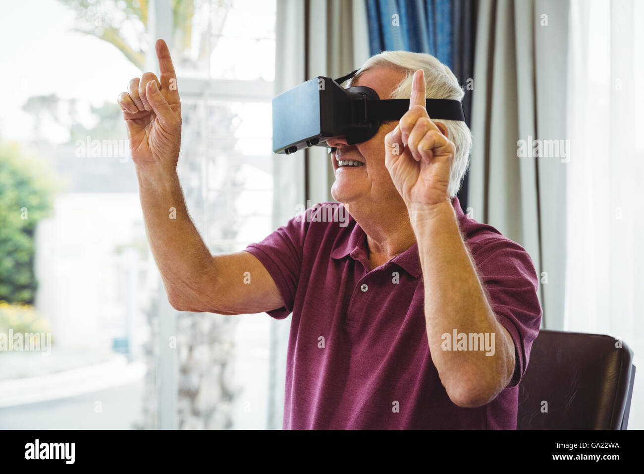 Elderly man using device hi-res stock photography and images - Alamy