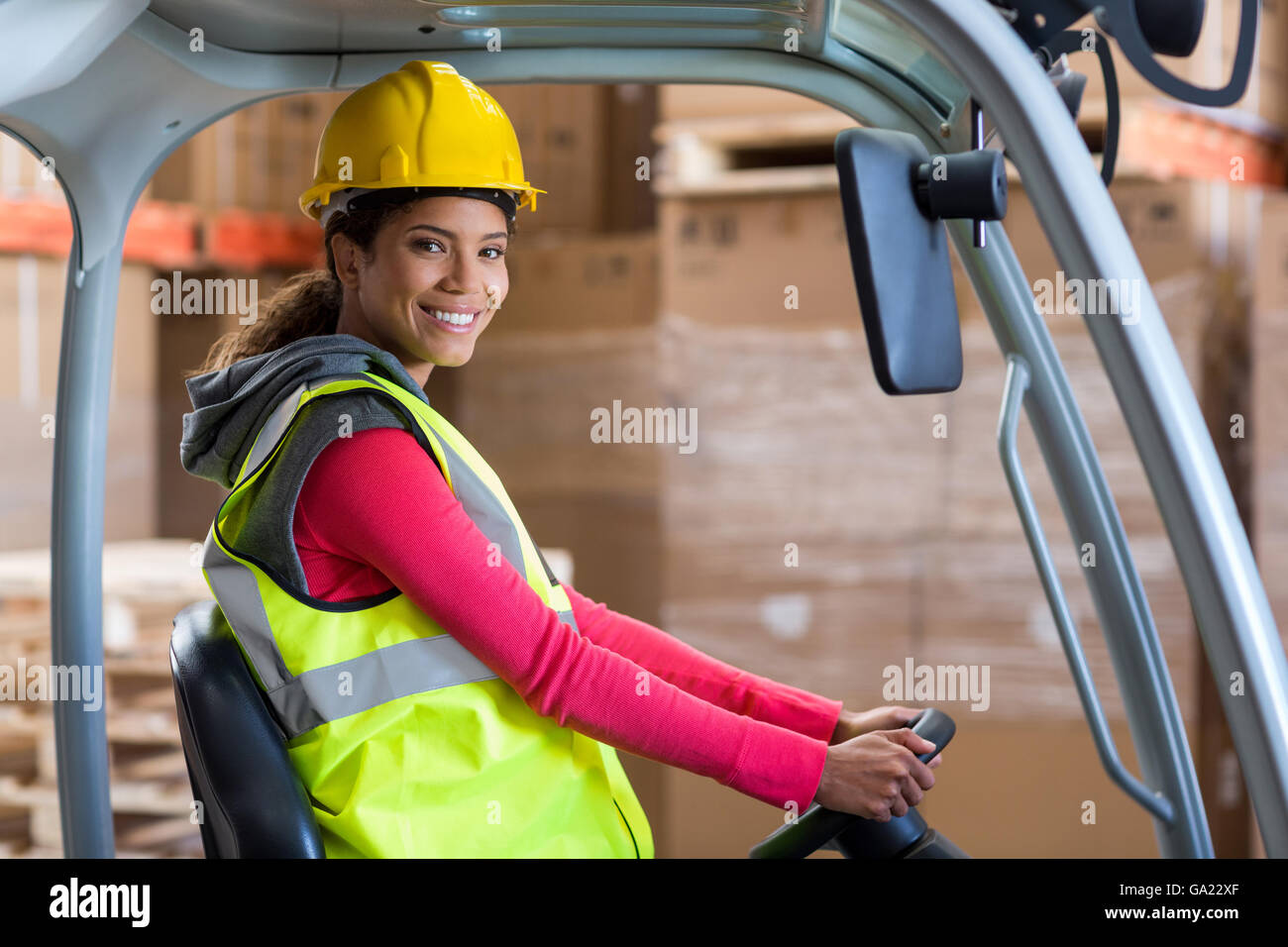 Portrait of smiling worker is posing during work Stock Photo - Alamy