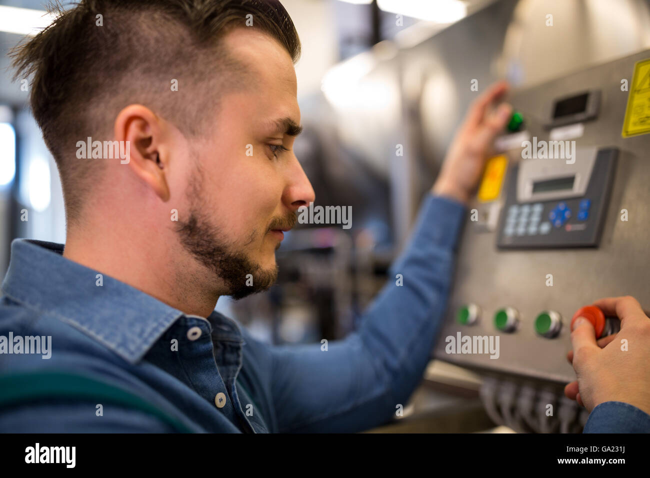 Worker operating hi-res stock photography and images - Alamy