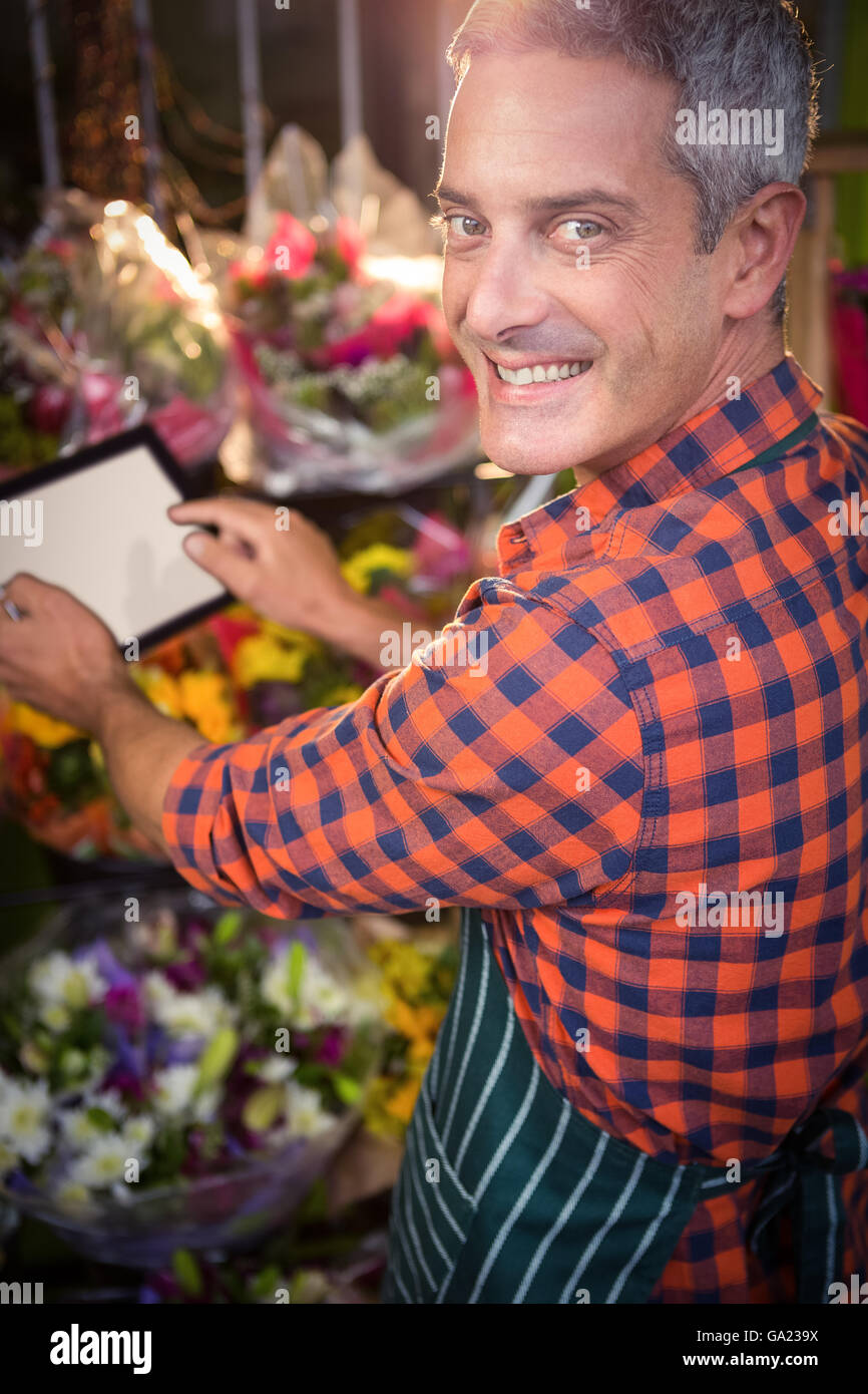 Male florist taking photo of flower bouquet Stock Photo - Alamy