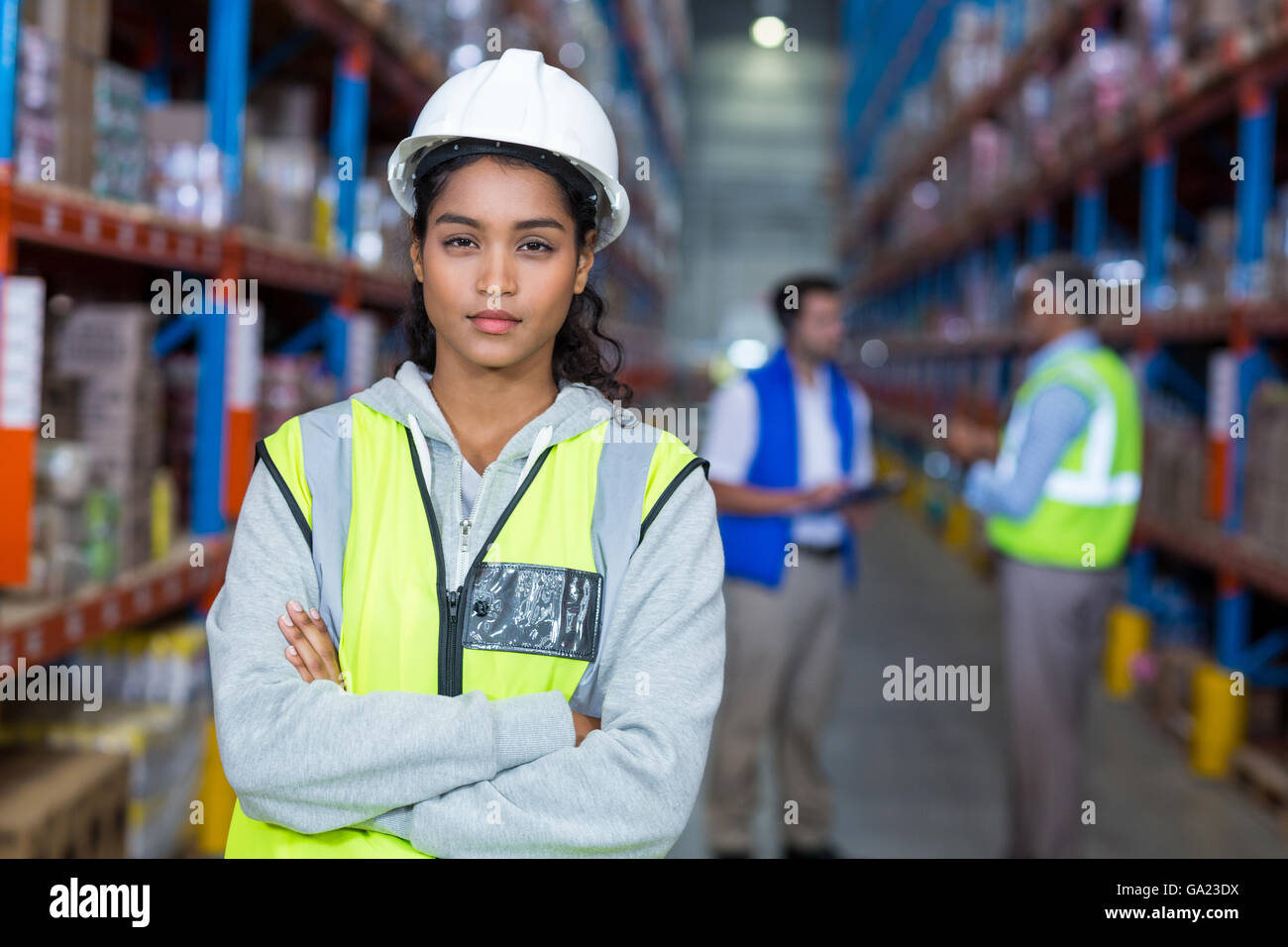 Worker crossing arms Stock Photo - Alamy
