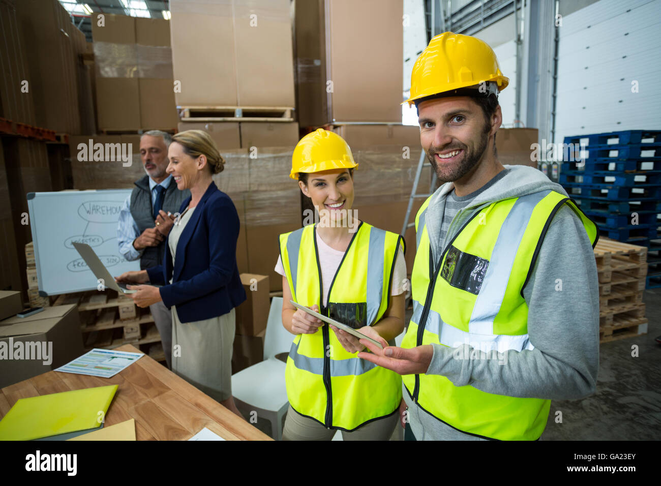 Colleague portrait wearing yellow security vest Stock Photo - Alamy