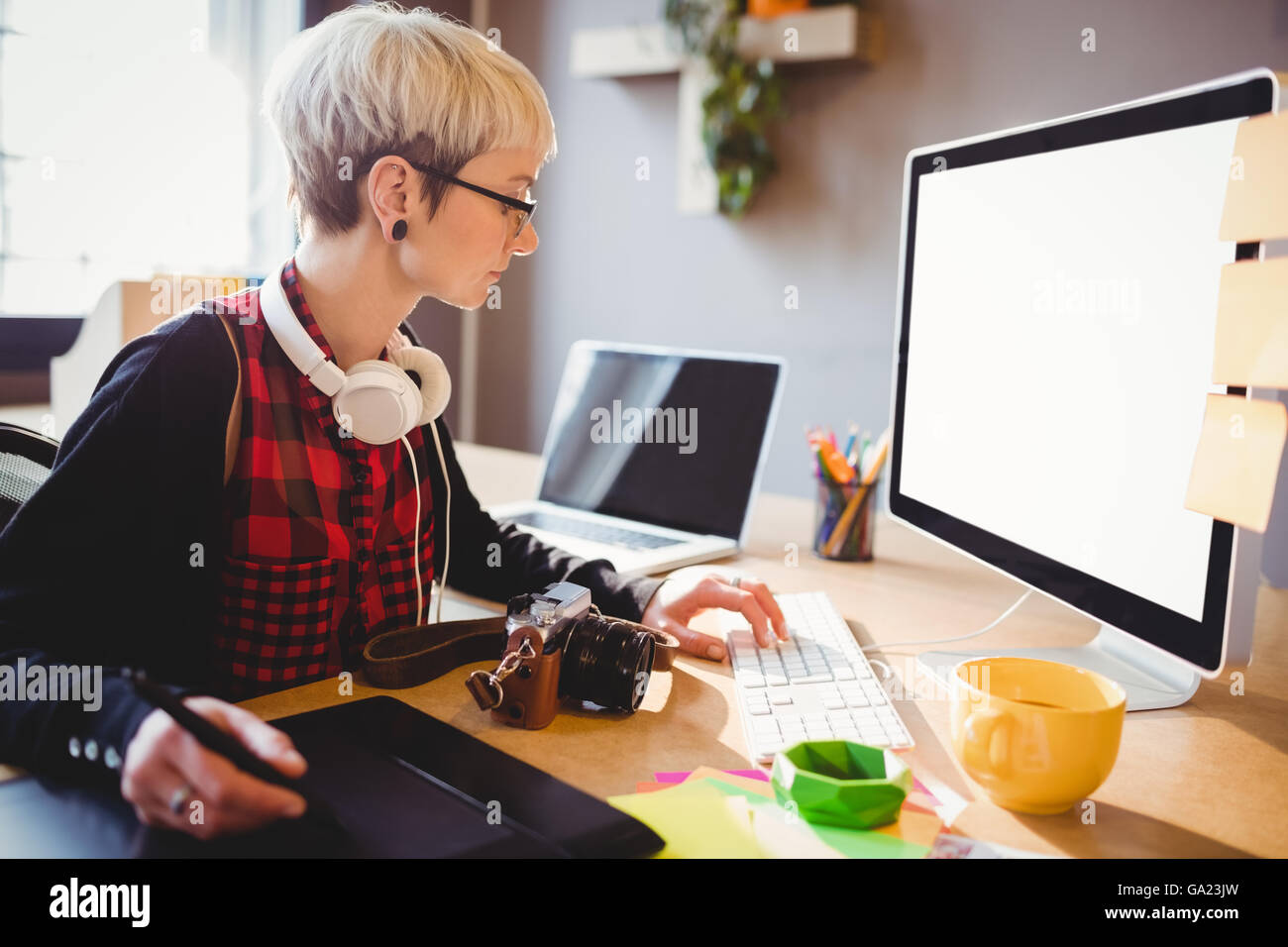 Graphic designer using graphics tablet Stock Photo - Alamy