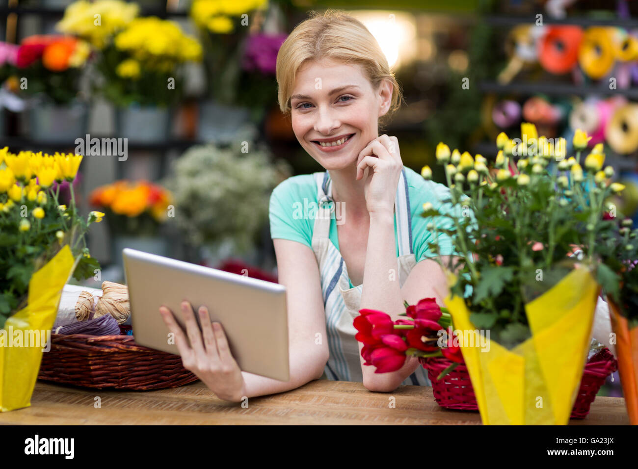 Female florist holding digital tablet Stock Photo - Alamy