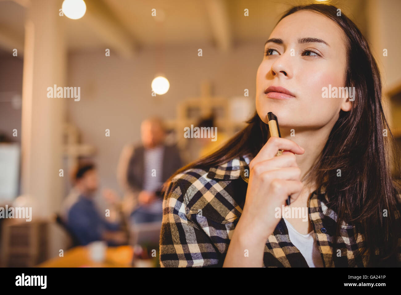 Close-up of thoughtful graphic designer Stock Photo - Alamy
