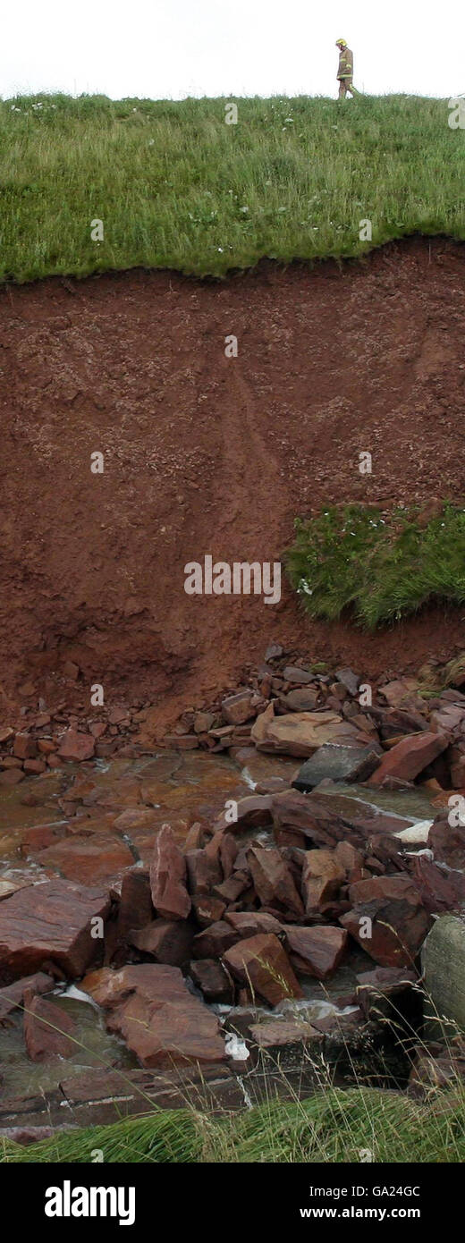 Firefighter walks on top of the ulley dam near rotherham hi-res stock ...