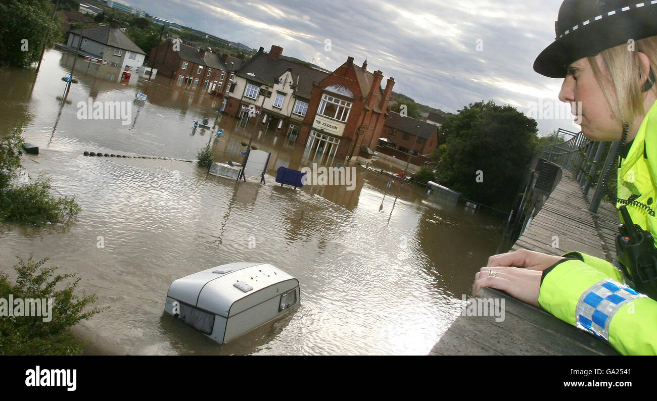 30-year-old Pc Burton looks out over the flooded village of Catcliffe ...