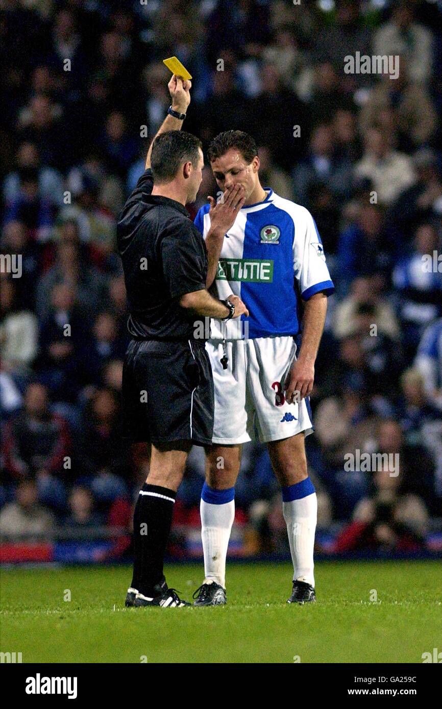Blackburn Rovers' Lucas Neill gets a yellow card from referee Rob ...