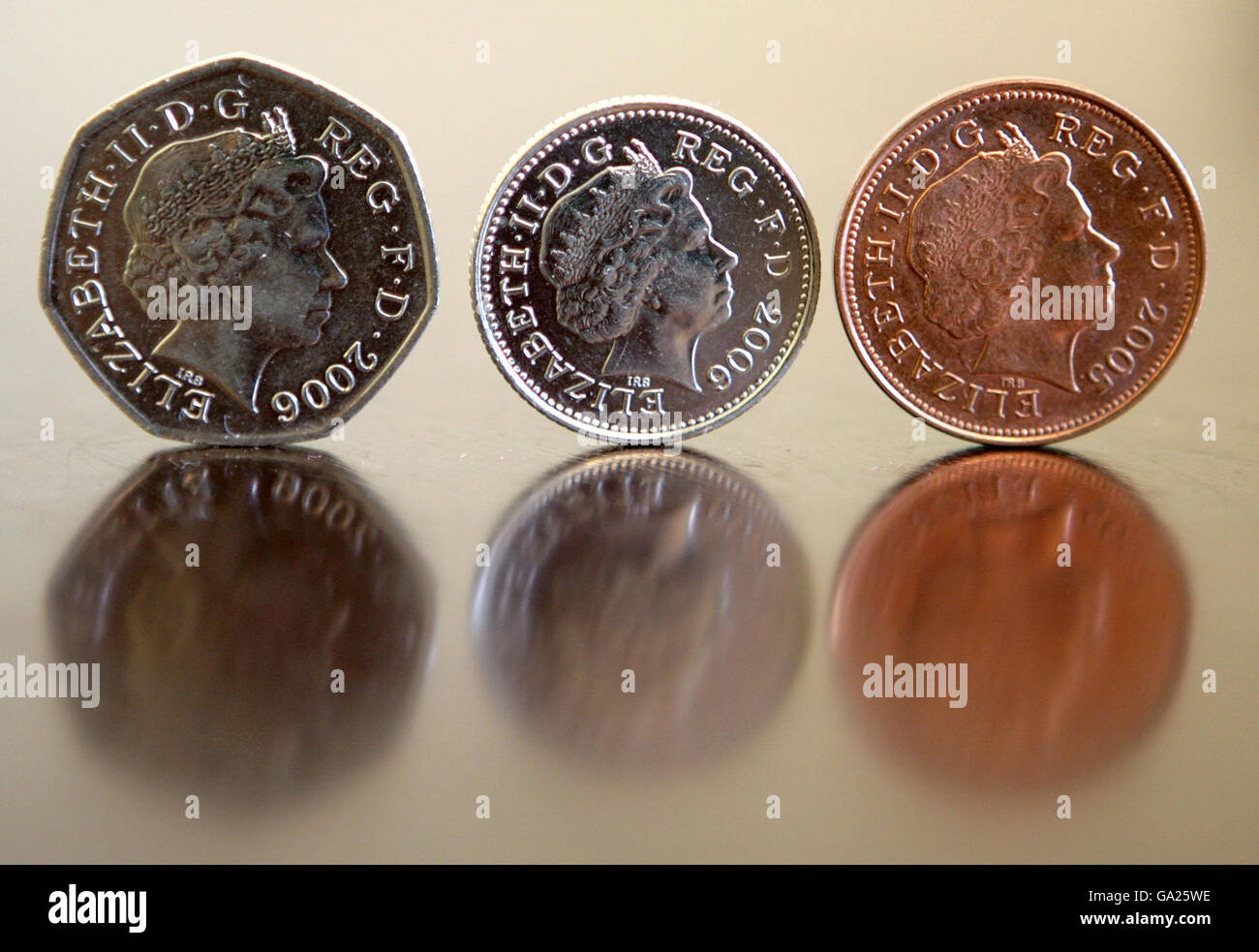 A fifty pence piece, a ten pence piece and a two pence piece, making a ...