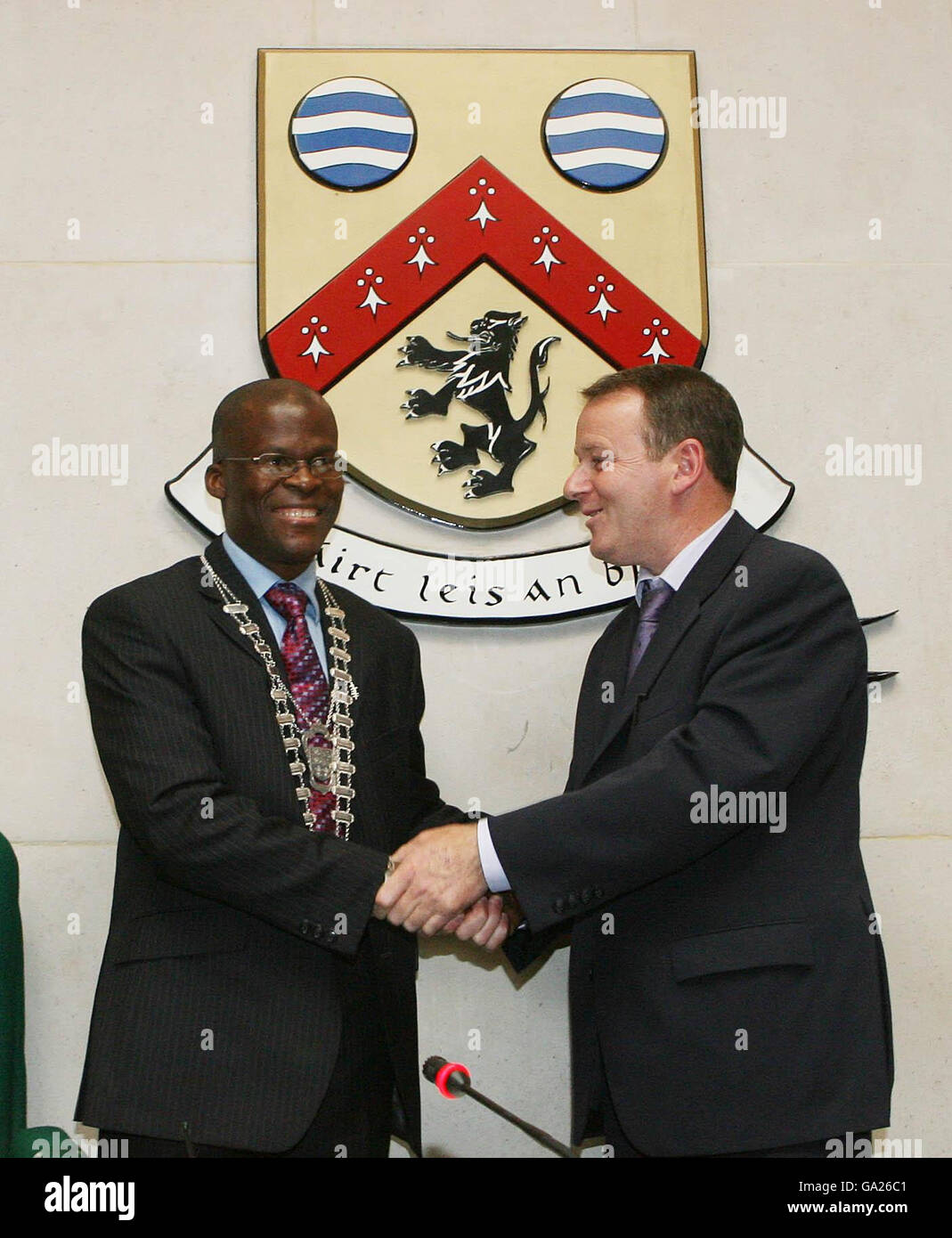 Nigerian-born Rotimi Adebari shakes hands with out-going Sinn Fein ...