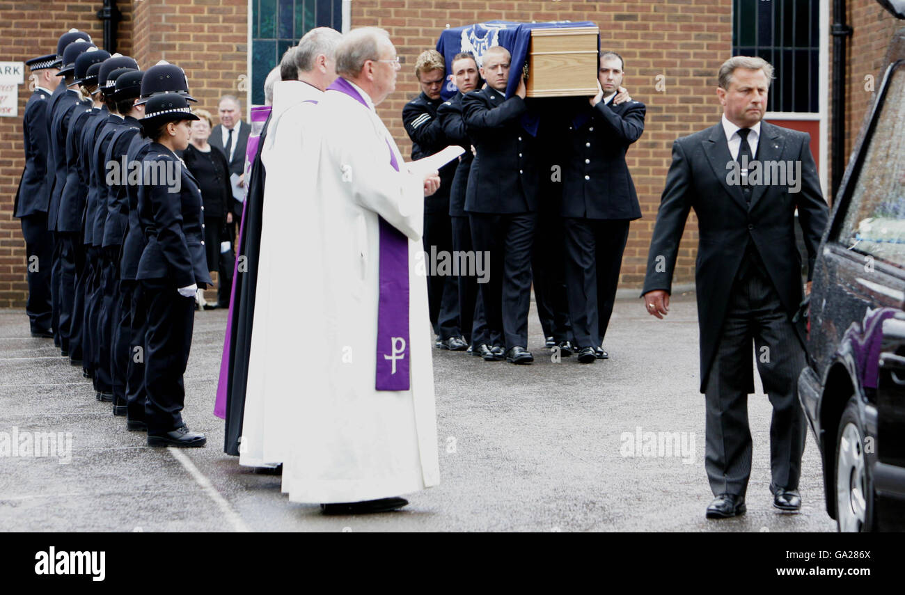 The coffin of murdered Policeman Pc Jon Henry is carried by his ...
