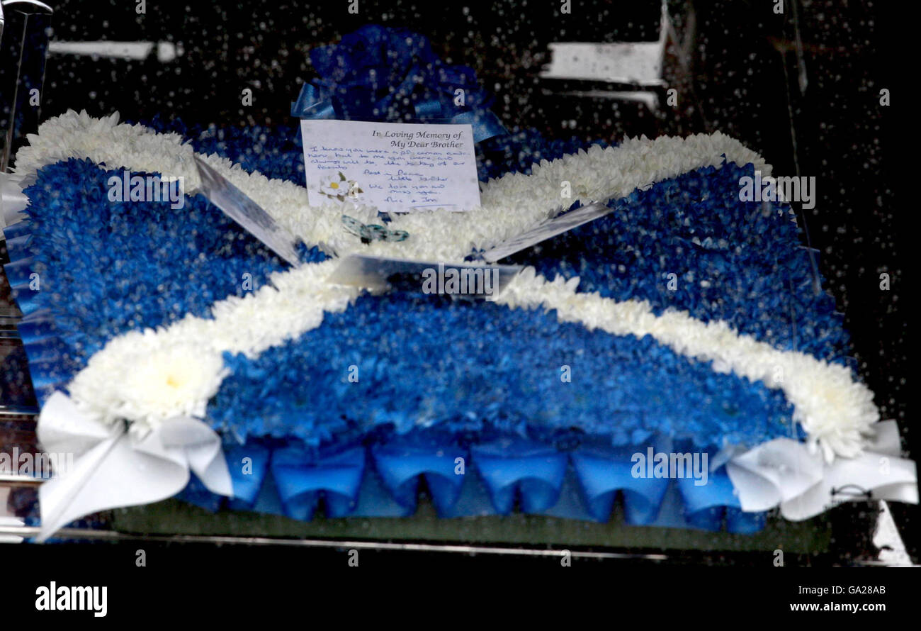 Flowers are seen in the hearse of murdered Policeman Pc Jon Henry after ...