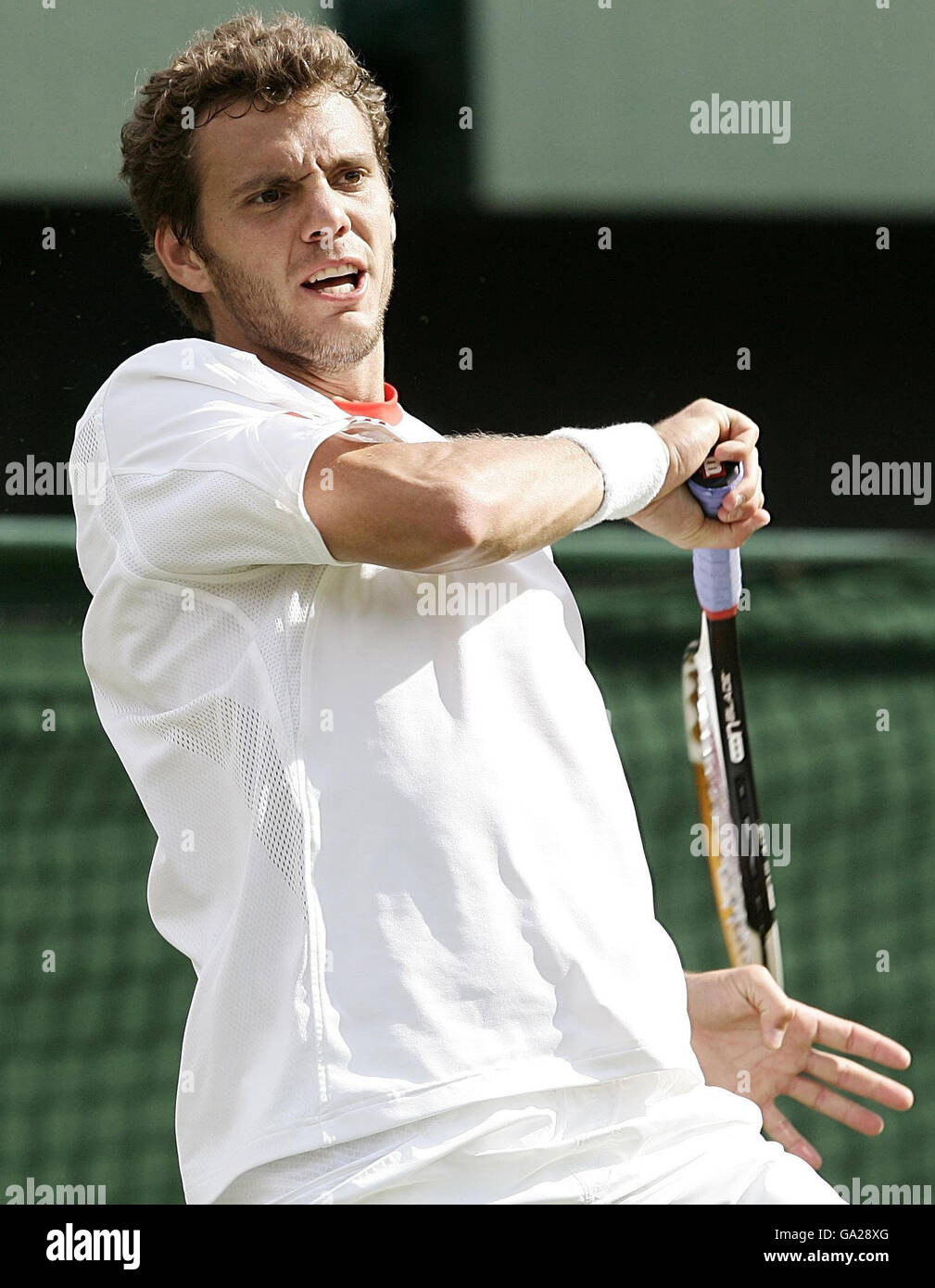 France's Paul-Henri Mathieu in action against USA's Andy Roddick during ...