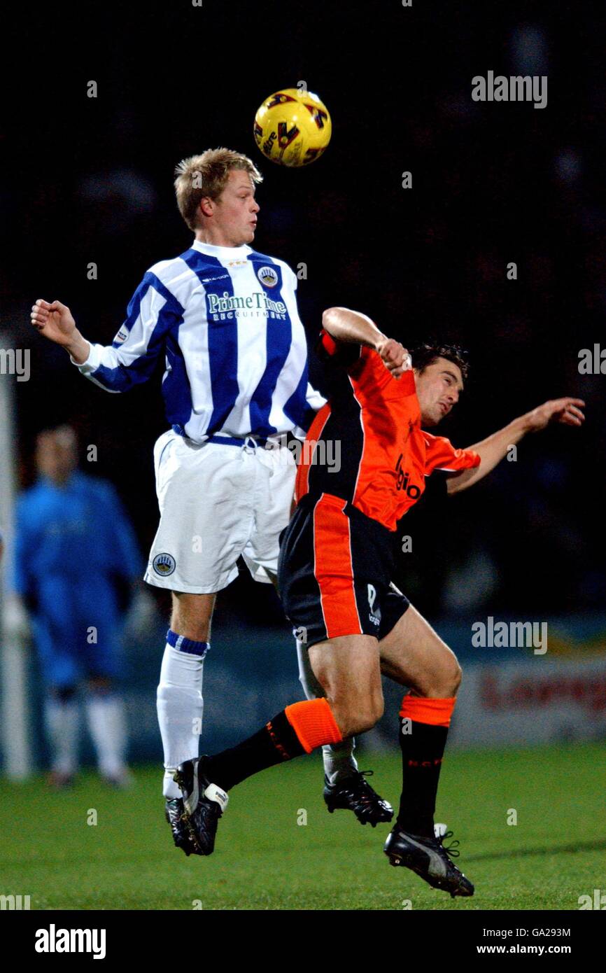 Huddersfield Town's Nathan Clarke (l) beats Notts County's Mark ...