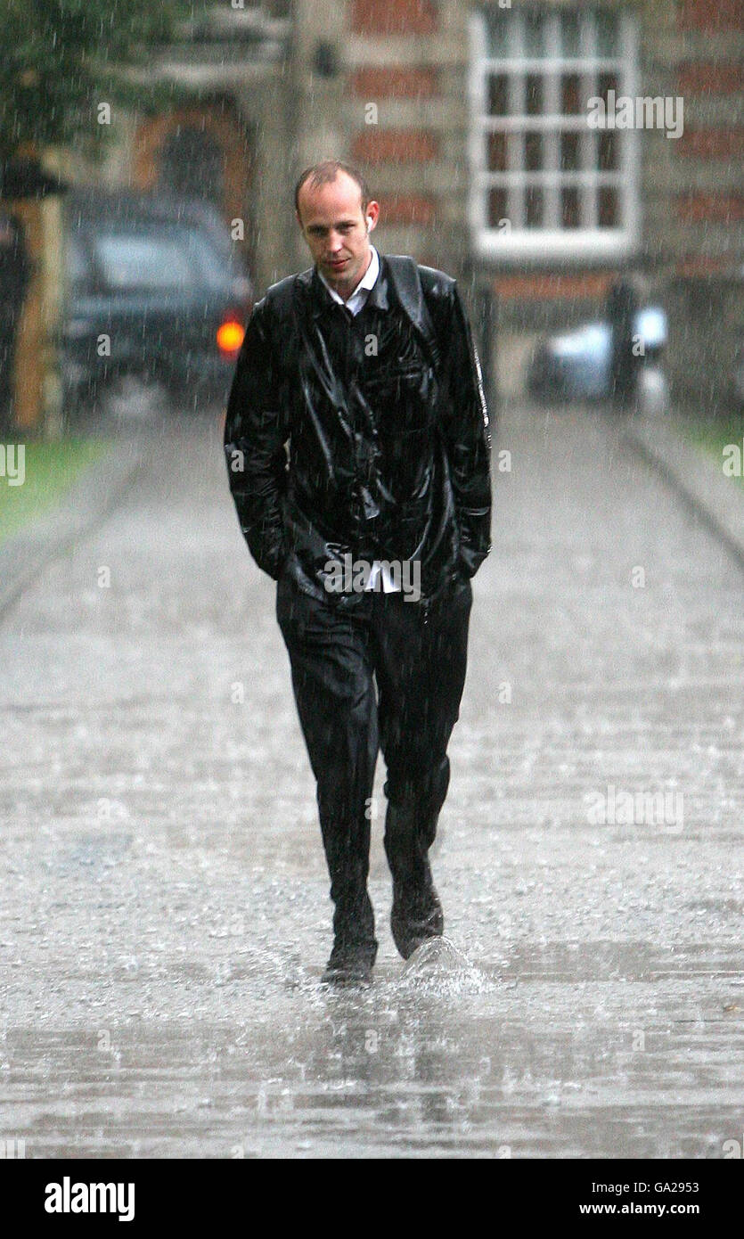 Standalone picture of a man running through heavy rain in Westminster ...