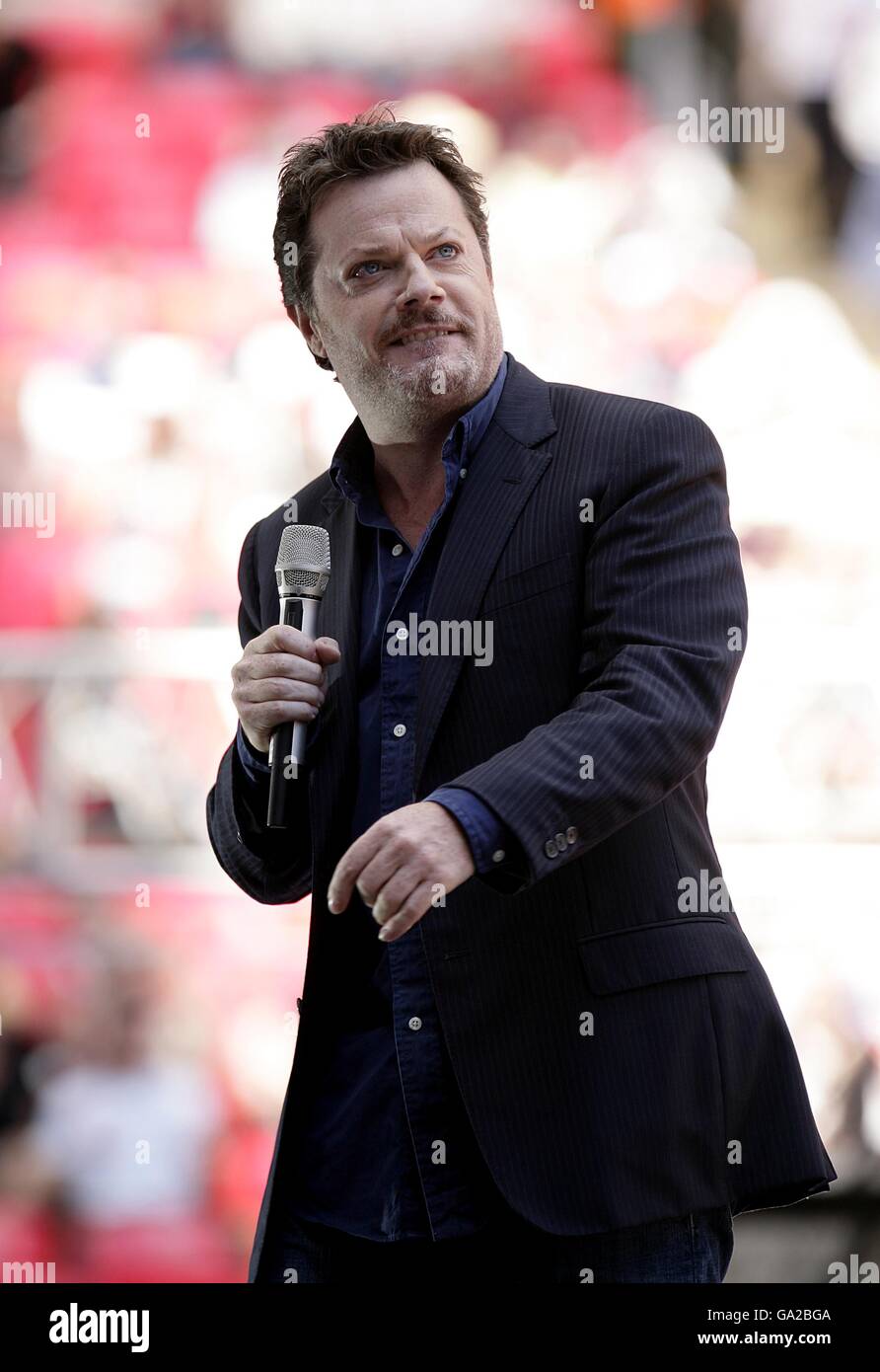 Eddie Izzard on stage during the charity concert at Wembley Stadium ...