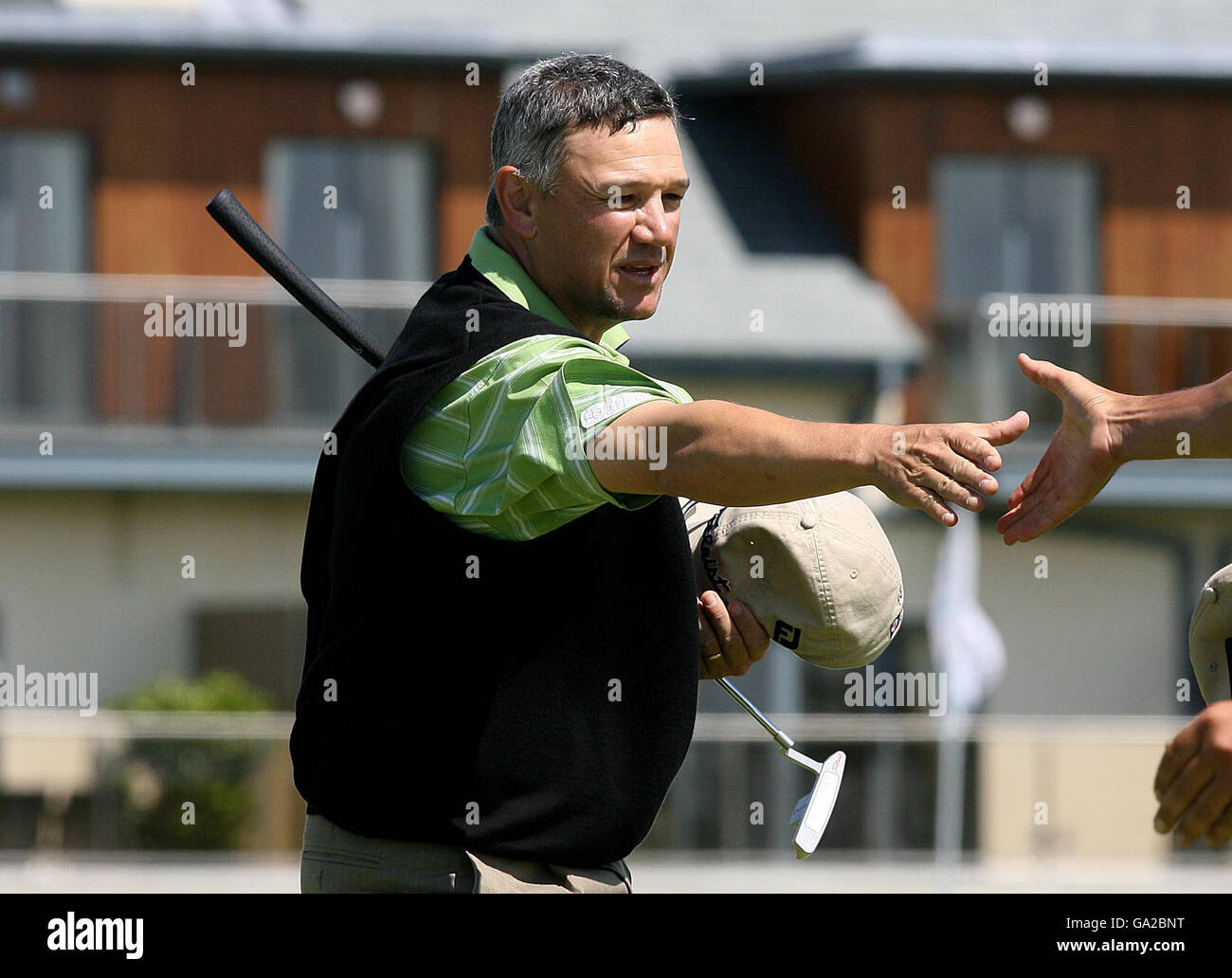 Australia's Peter O'Malley shakes hands with his playing partner during ...