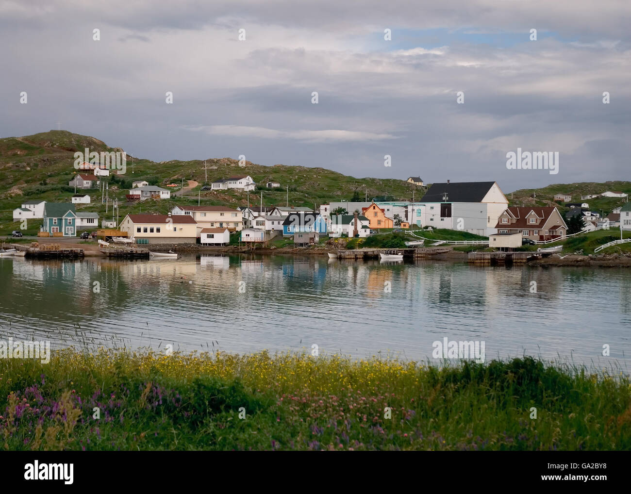 Newfoundland outport village reflected in ocean Stock Photo - Alamy