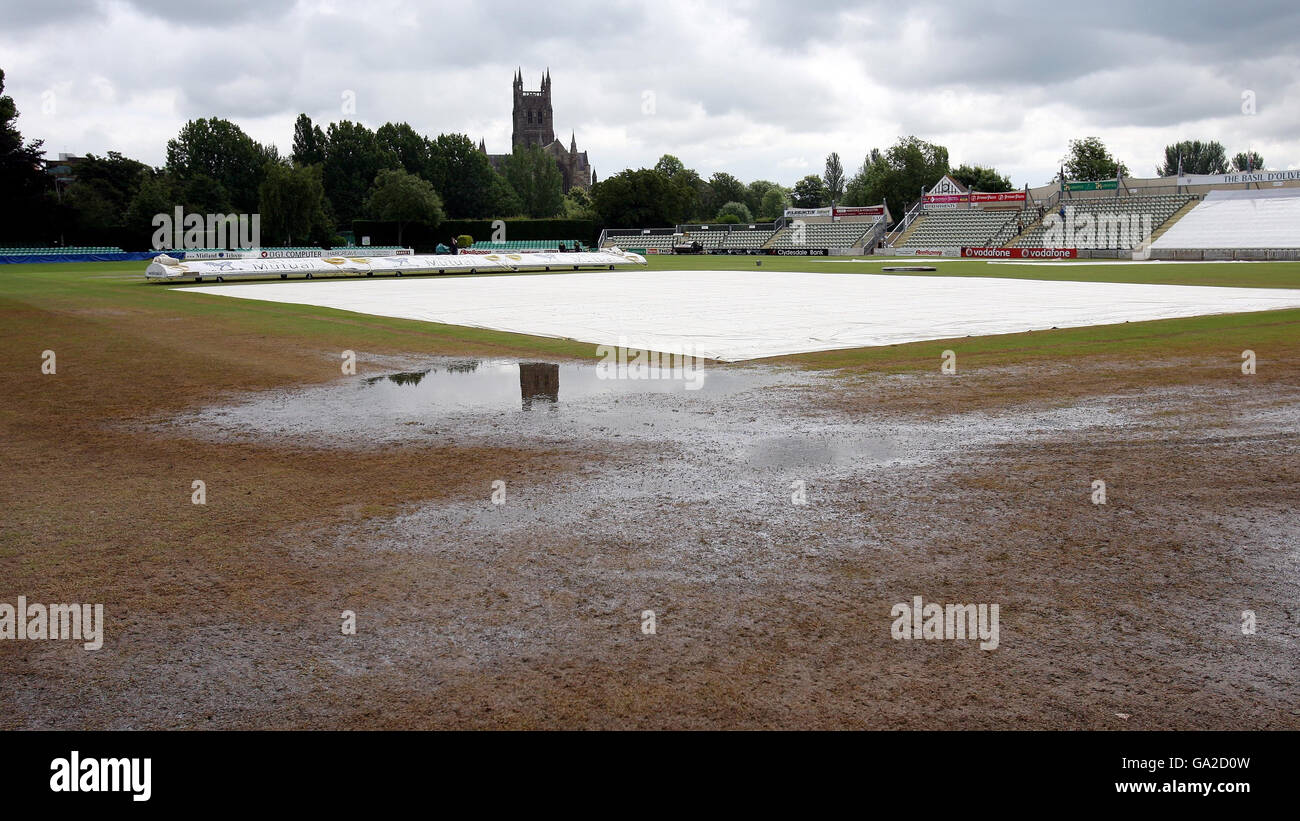 Puddles still lie on a muddy and saturated outfield before the ...