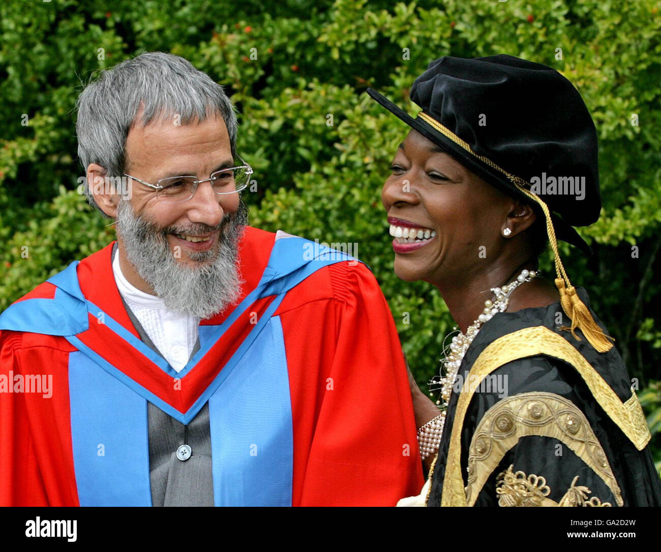Yusuf Islam (left), formerly known as Cat Stevens, shares a laugh with ...