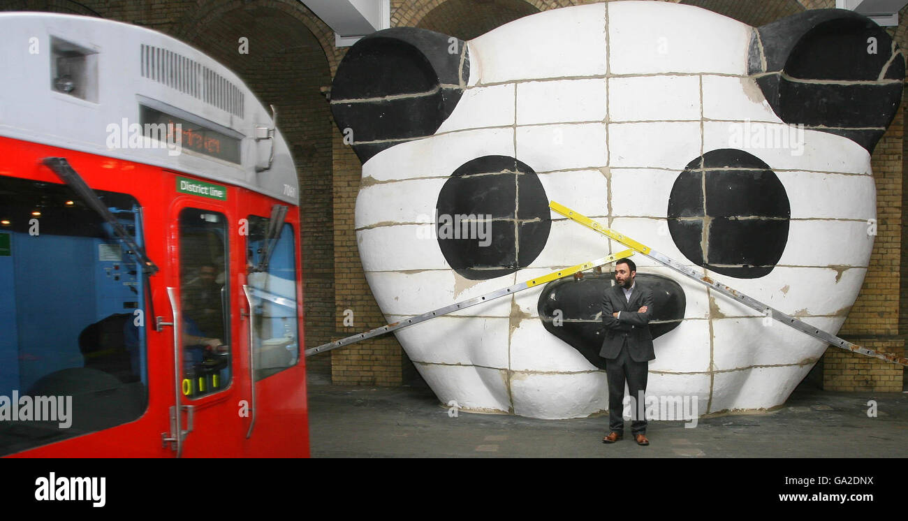 Brian Griffiths stands with his Art Installation on a platform in ...