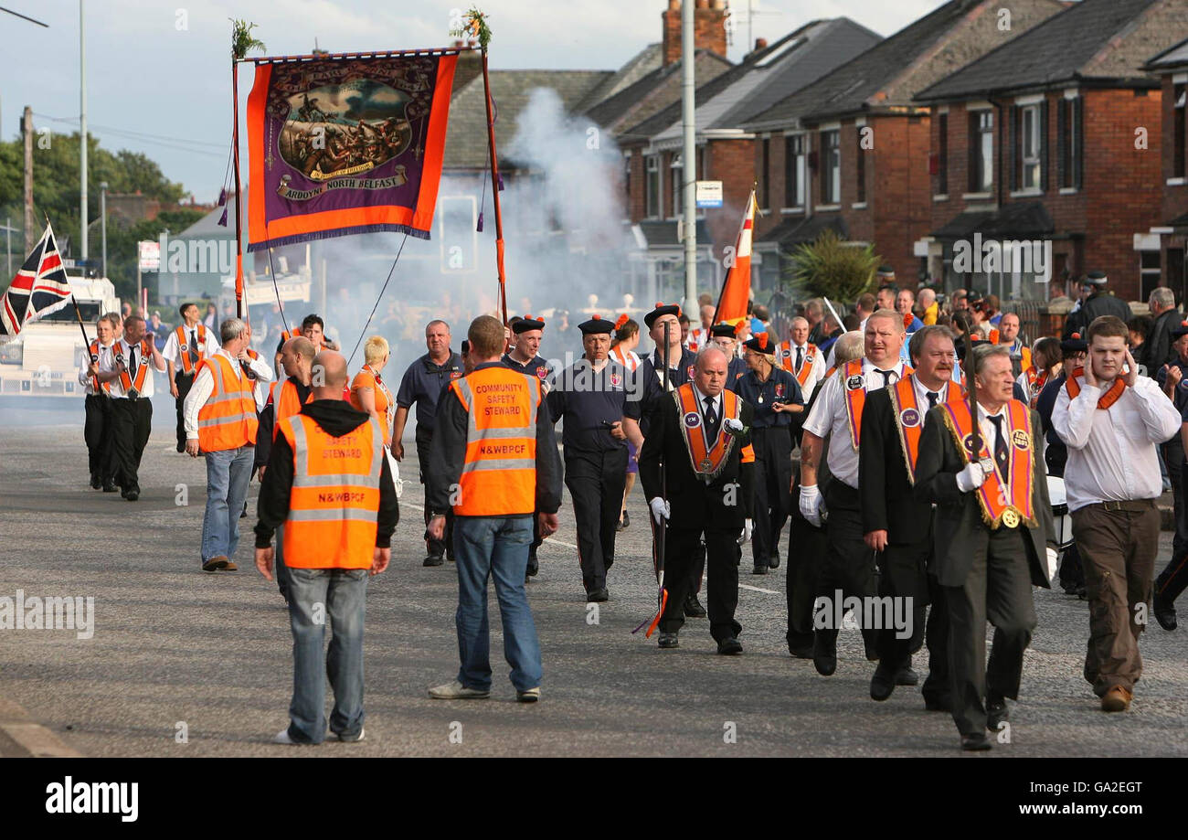 Fireworks explode as the controversial Orange Parade passes through the ...
